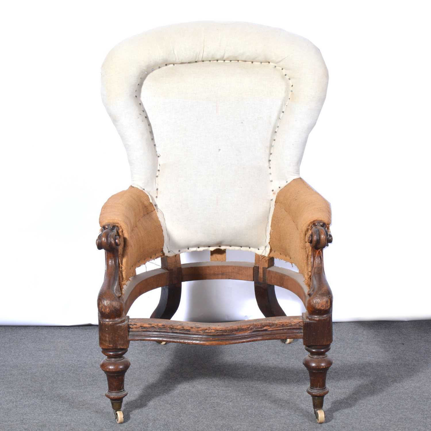Lot 559 - Victorian oak framed balloon back easy chair
