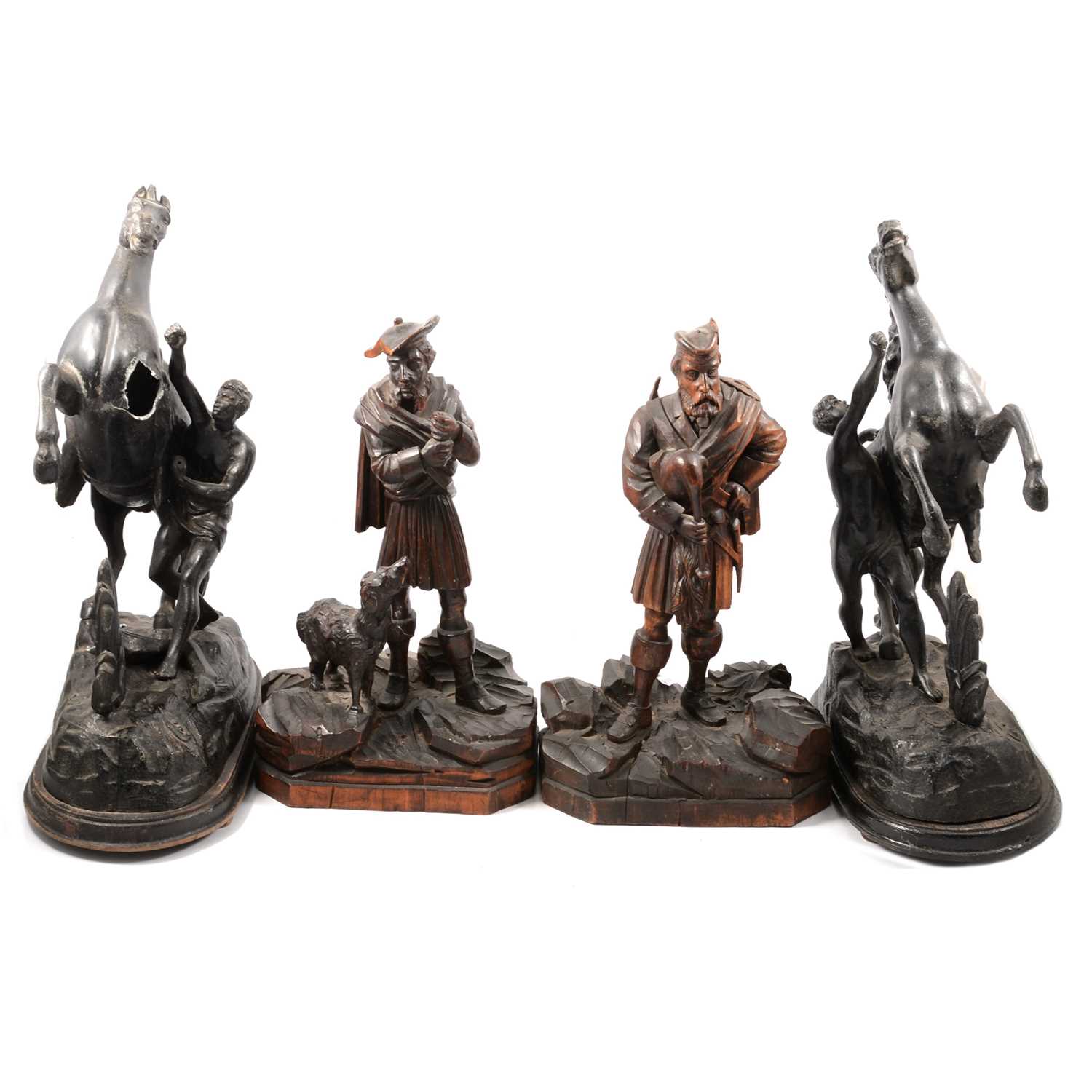 Lot 192 - Pair of carved Highlander figures, and a