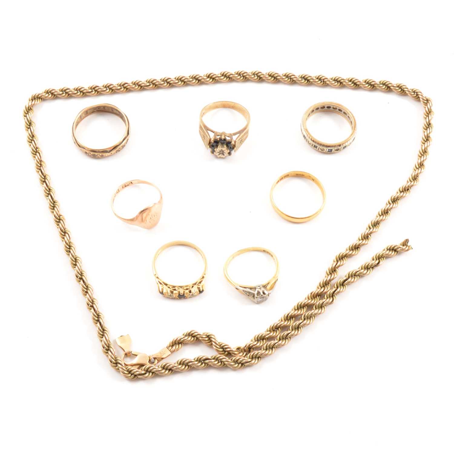 Lot 268 - Seven gold rings and a gold necklace.