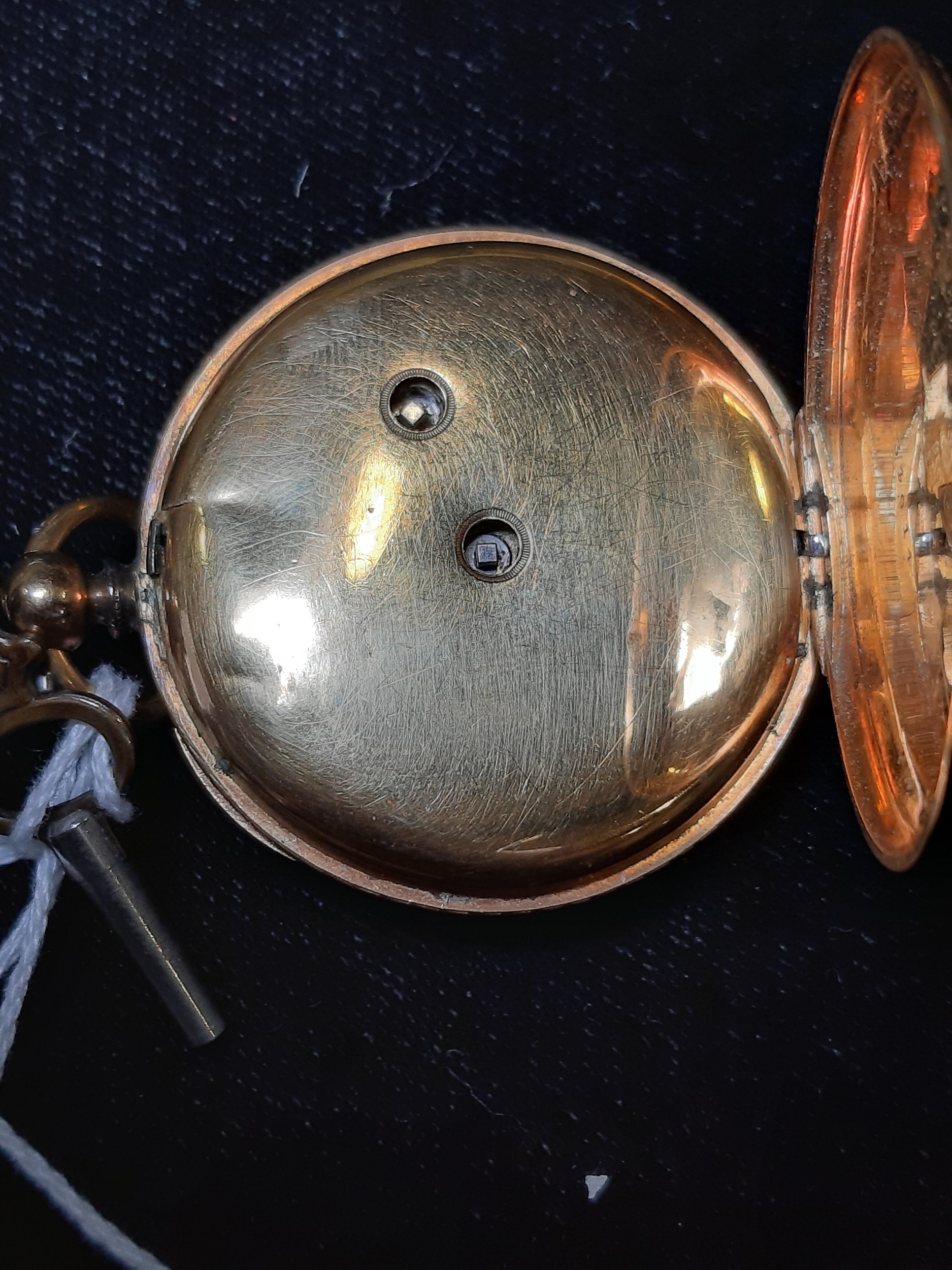Lot 147 - A yellow metal open face pocket watch.