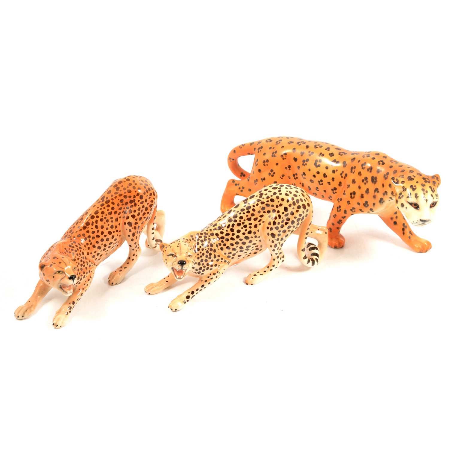 Lot 69 - Three Beswick pottery leopard models,