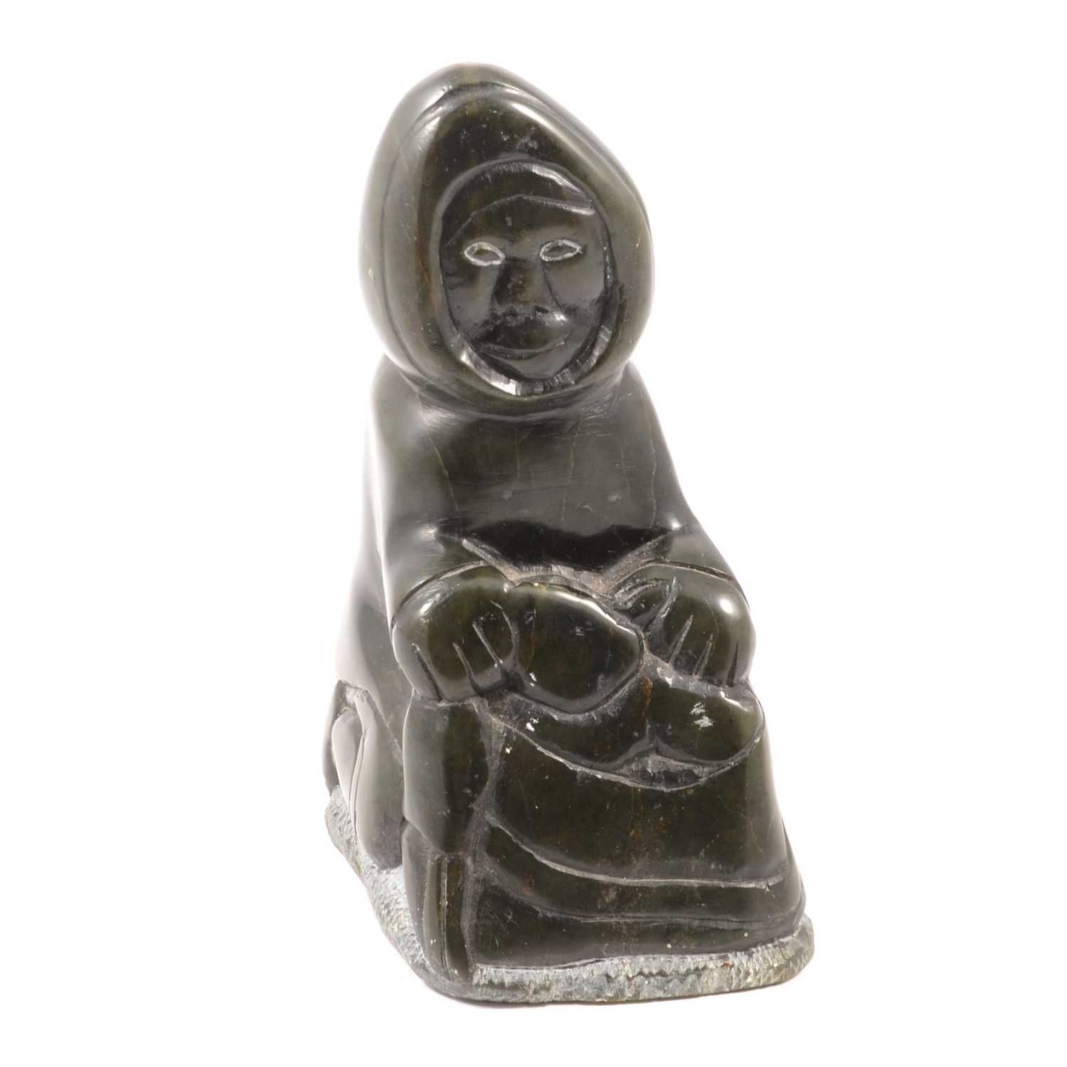 Lot 148 - Inuit carved stone seated figure,