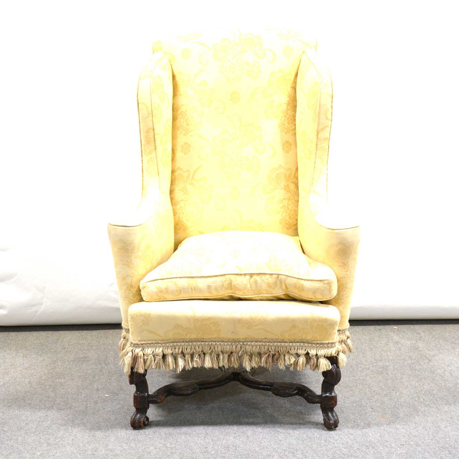 Lot 423 - George III style wing back armchair,