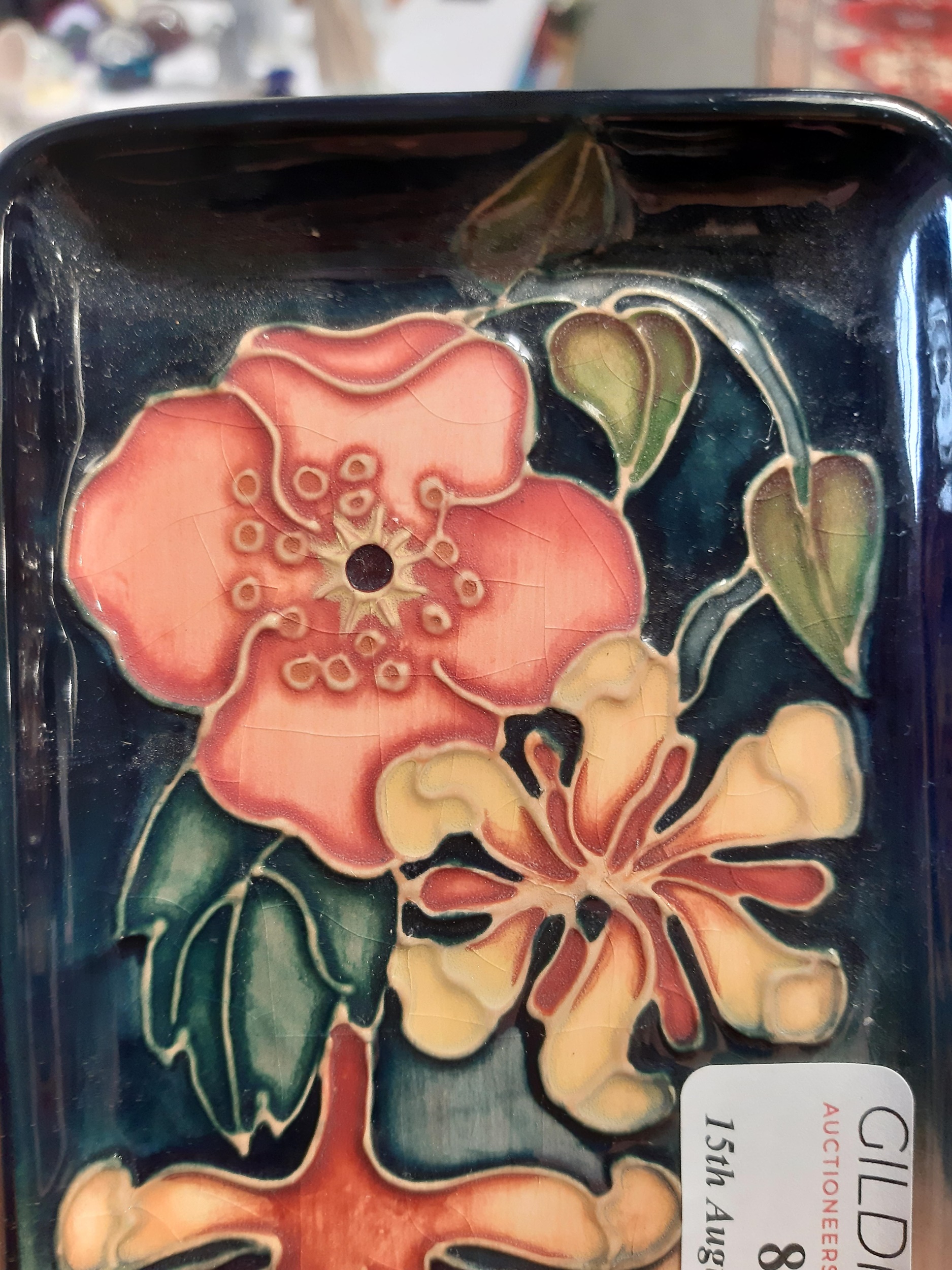 Lot 8 - Moorcroft Pottery - two vases and a tray, plus
