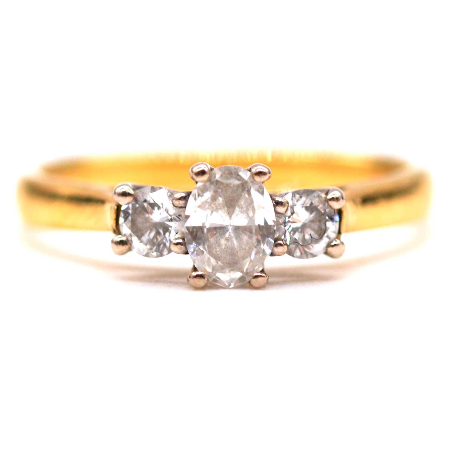Lot 19 - A diamond three stone ring.
