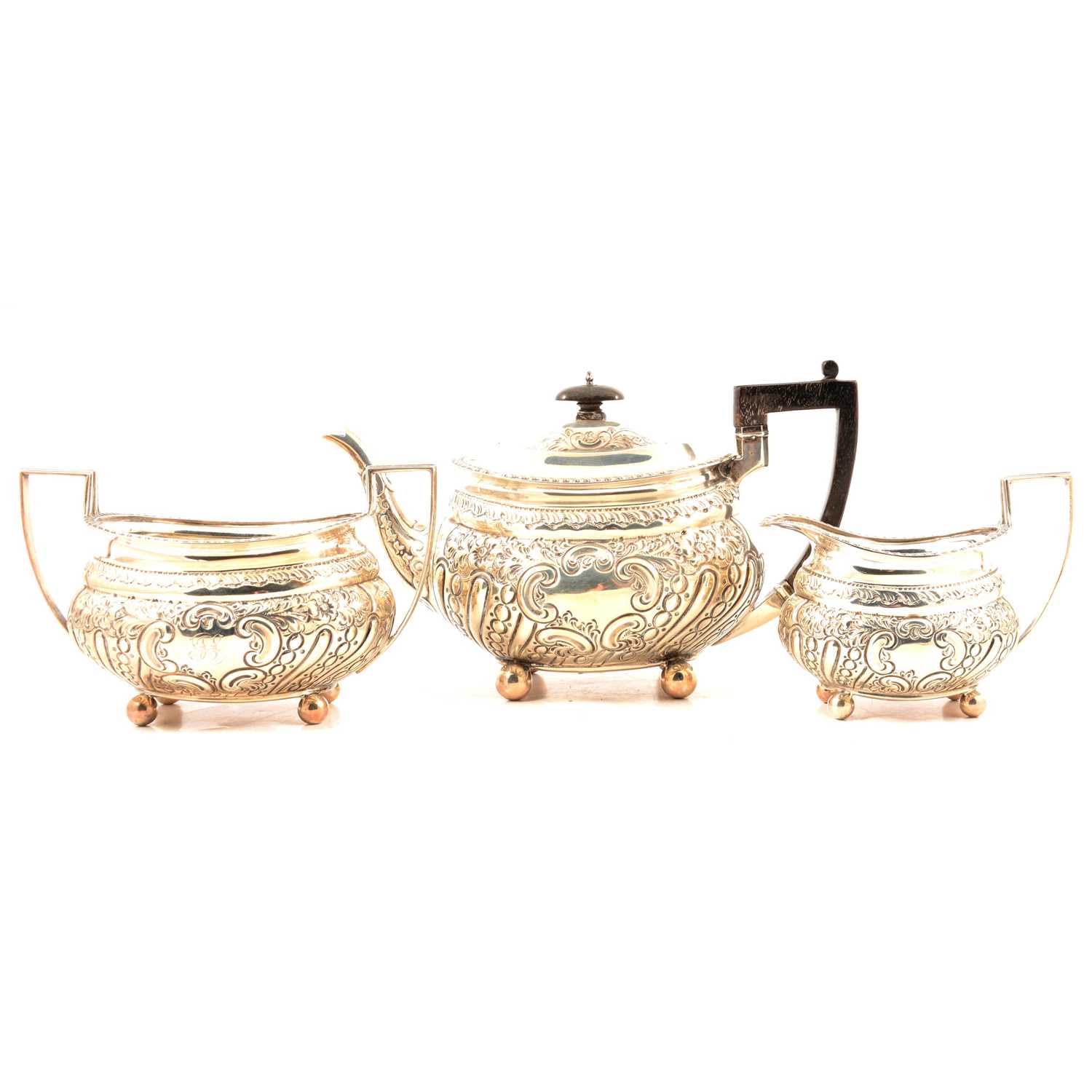 Lot 220 - Silver three piece tea set,