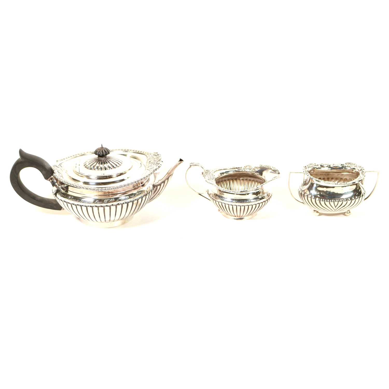 Lot 743 - Silver matched three piece tea set,