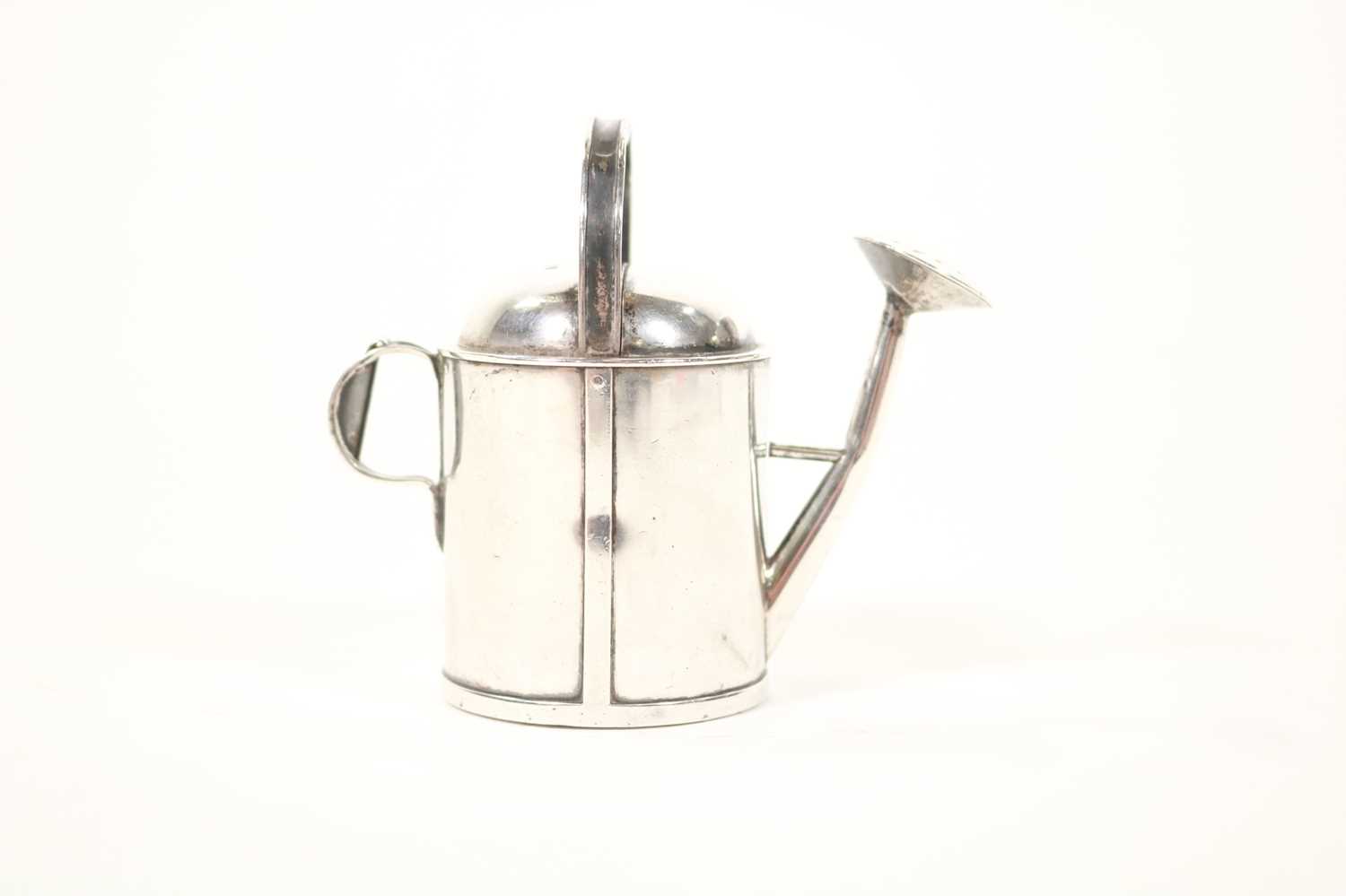 Lot 735 - A novelty silver watering can scent atomiser,