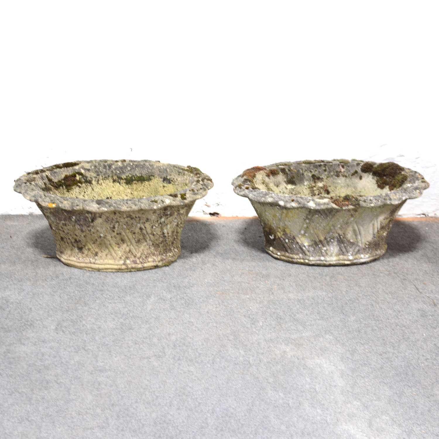 Lot 814 - Pair of Haddonstone plaited Basket planters,