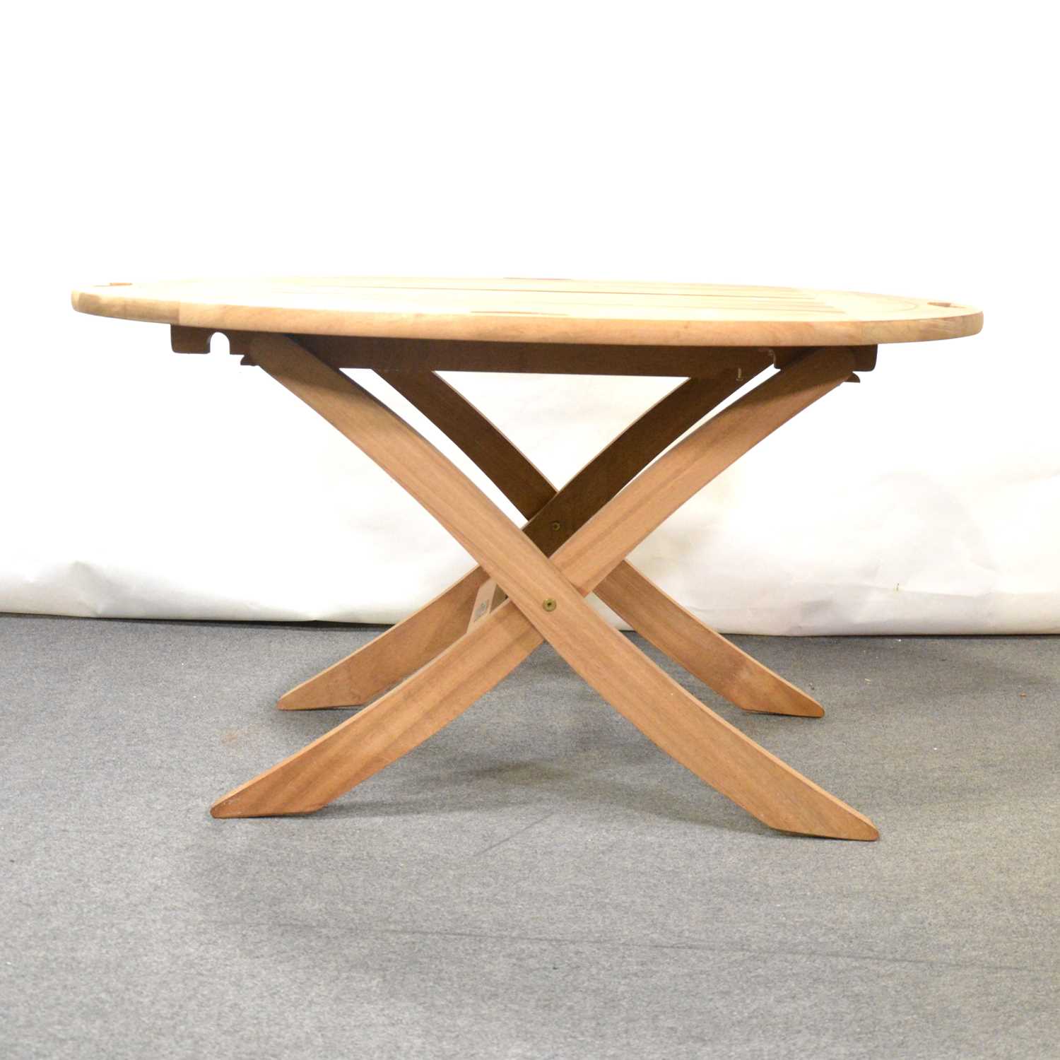 Lot 150 - Small teak folding oval-top garden table