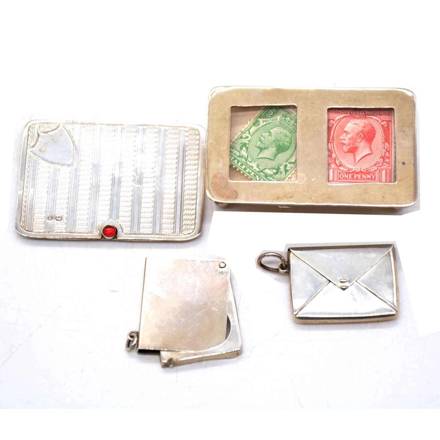 Lot 338 - Four silver stamp cases,