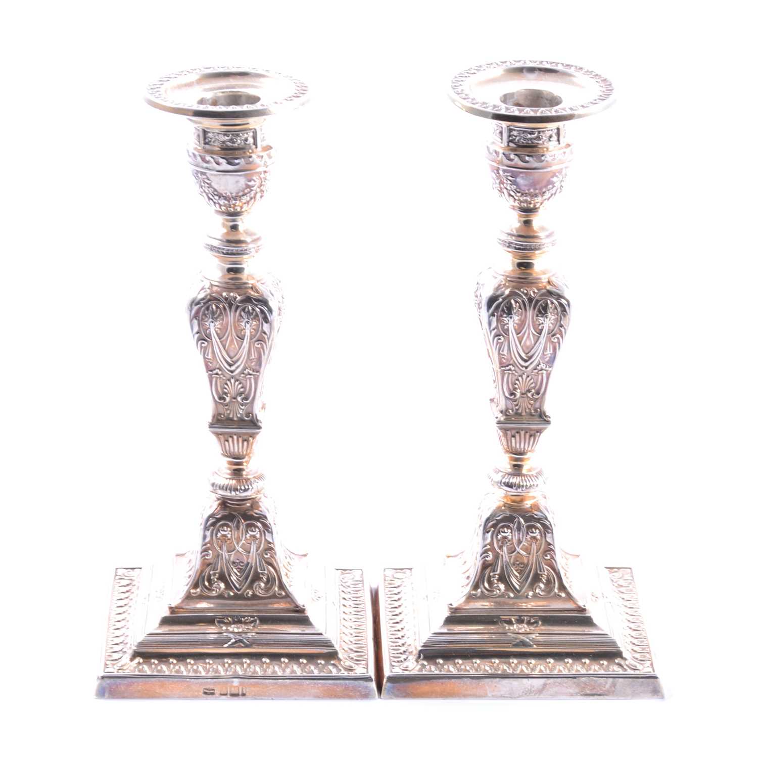 Lot 223 - Pair of Edwardian silver candlesticks,