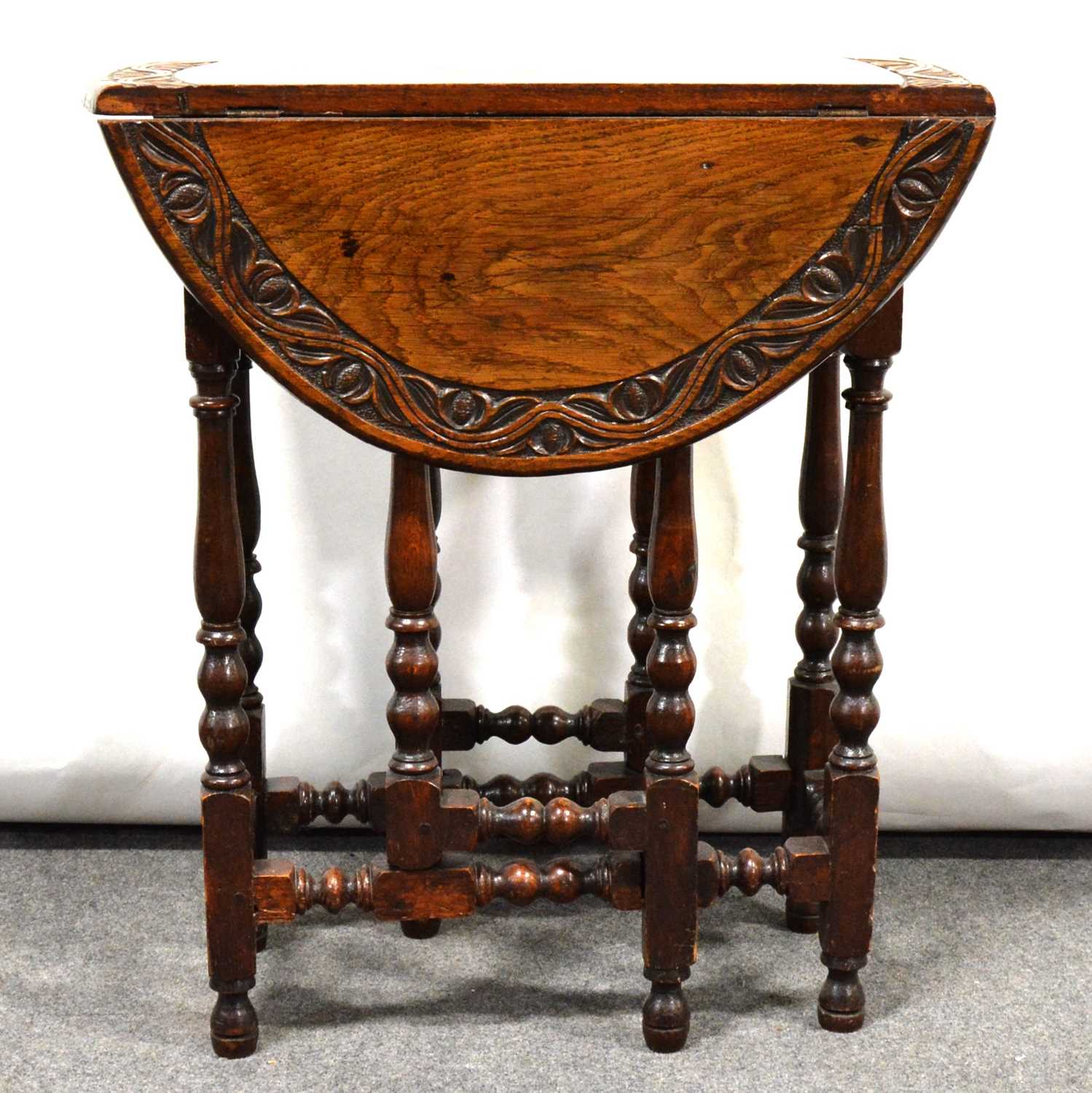 Lot 465 - Carved oak Sutherland table,