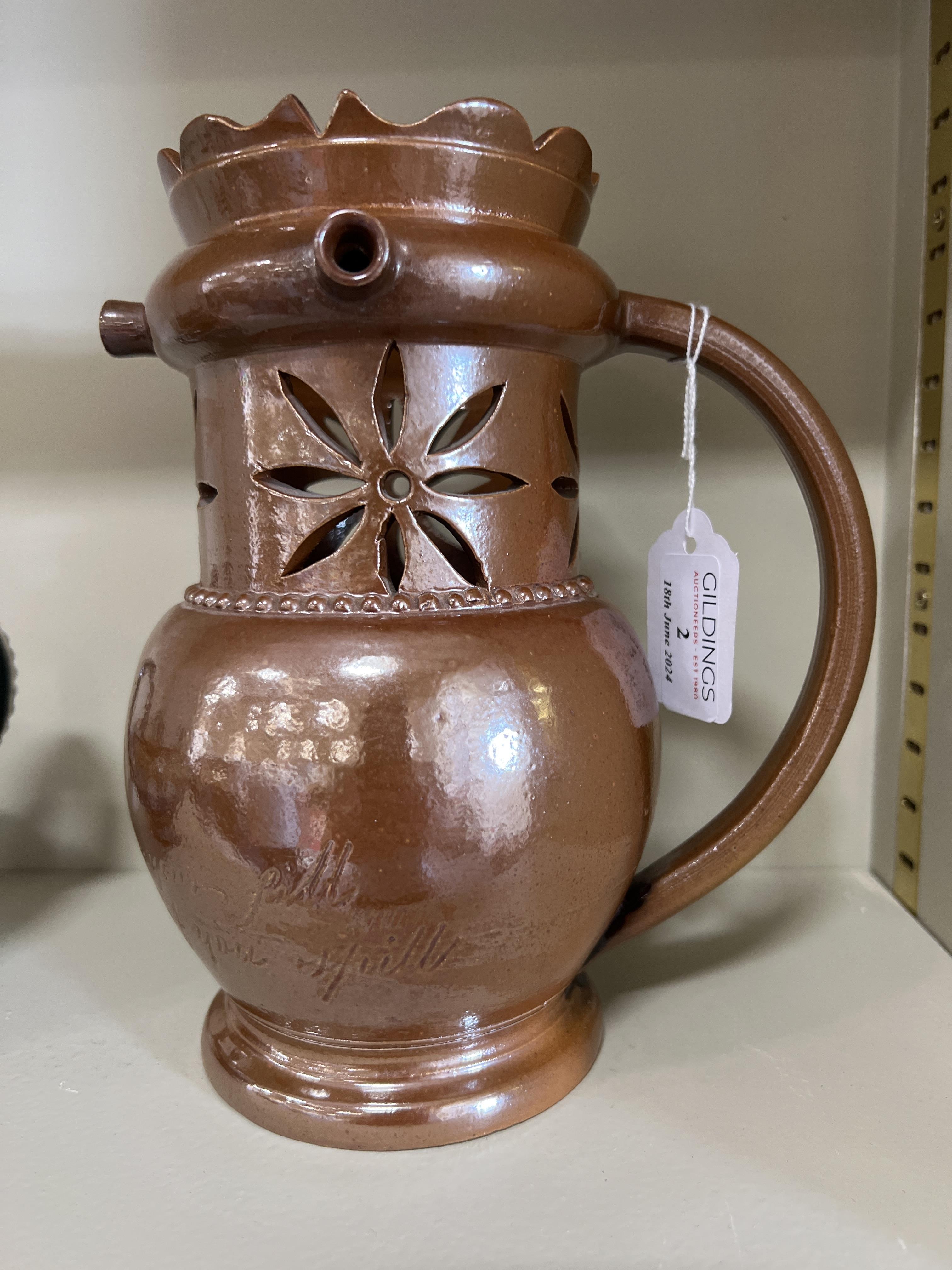 Lot 2 - Derbyshire saltglazed stoneware puzzle jug,