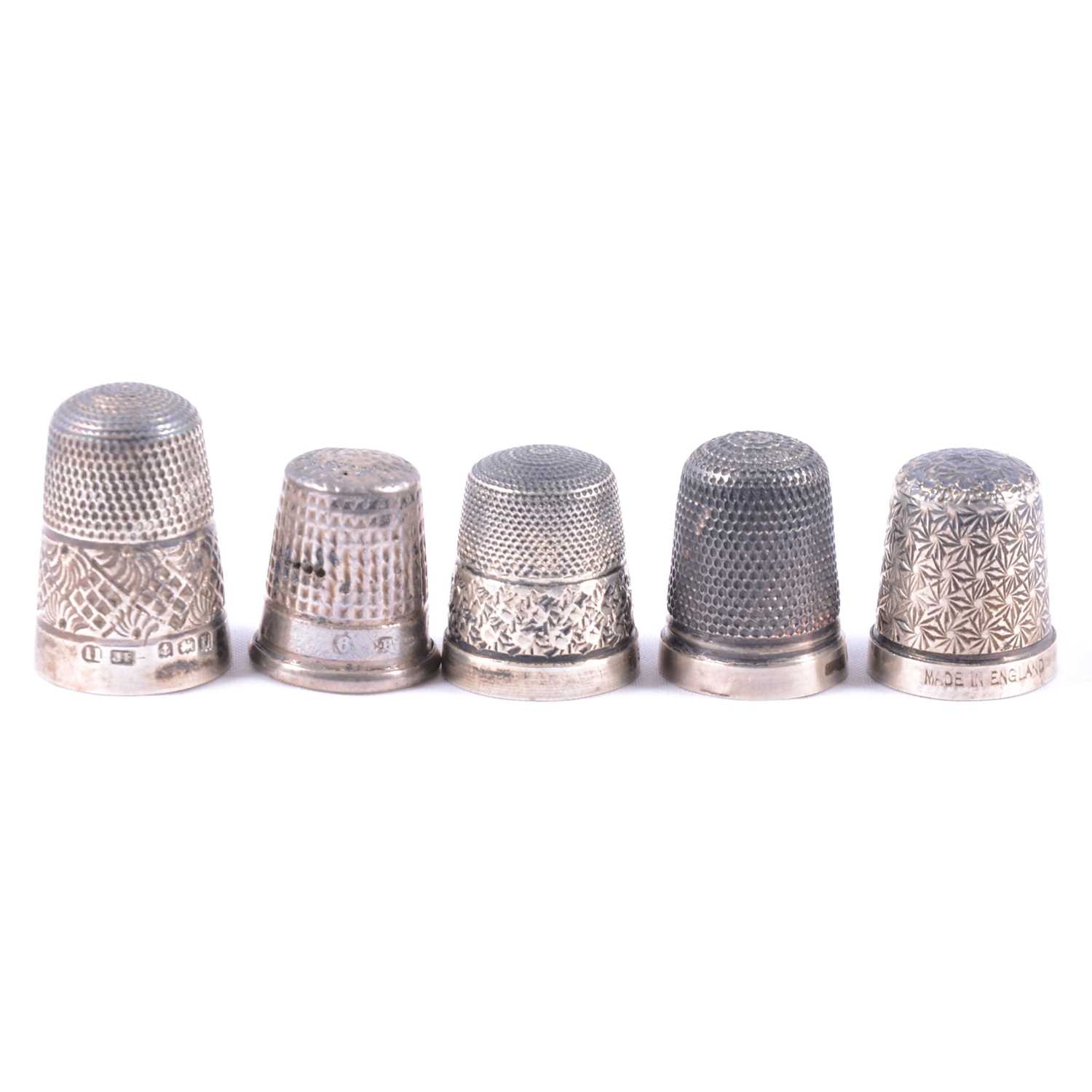Lot 216 - Five silver thimbles,