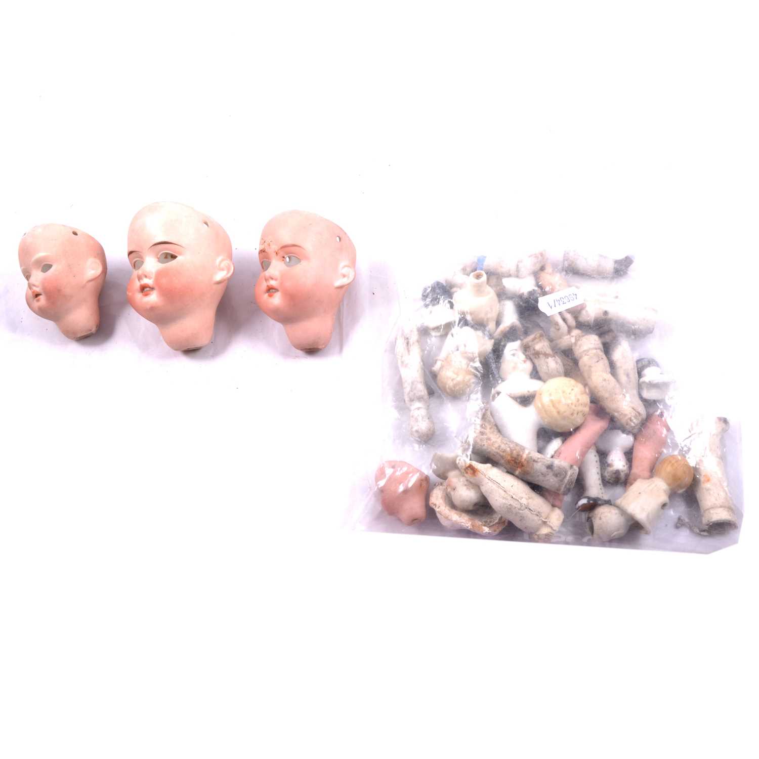 Lot 237 - Collection of bisque dolls' heads, arms,
